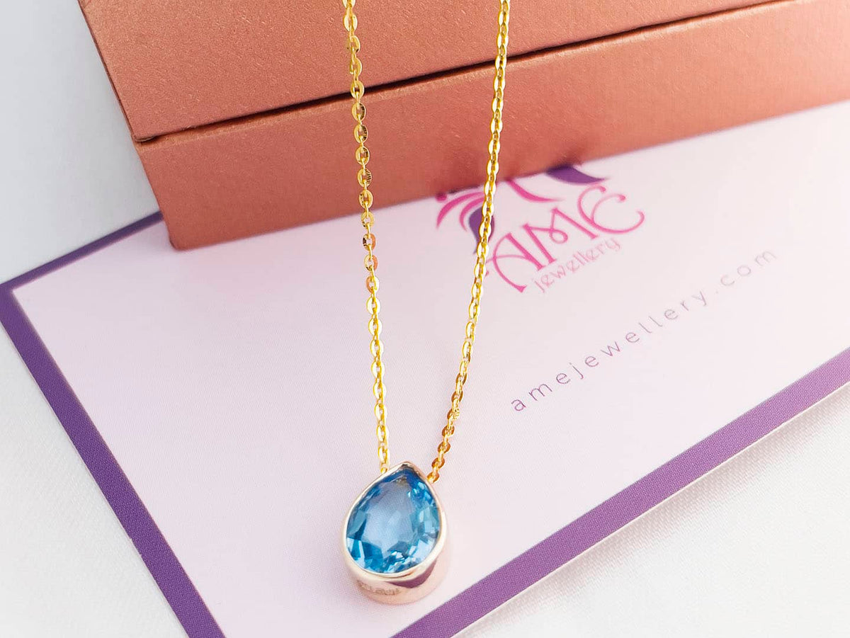 Pear-cut Blue Topaz Bezel Pendant in 14K Yellow Gold | AME Jewellery