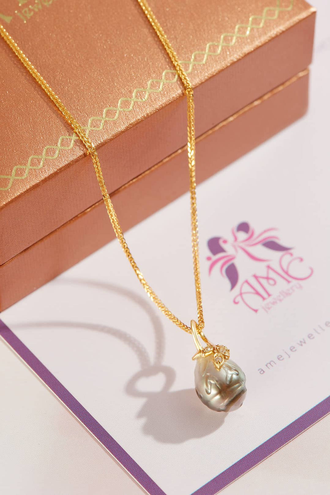 AME Jewellery crafts gold silver jewelry with gemstones and pearls